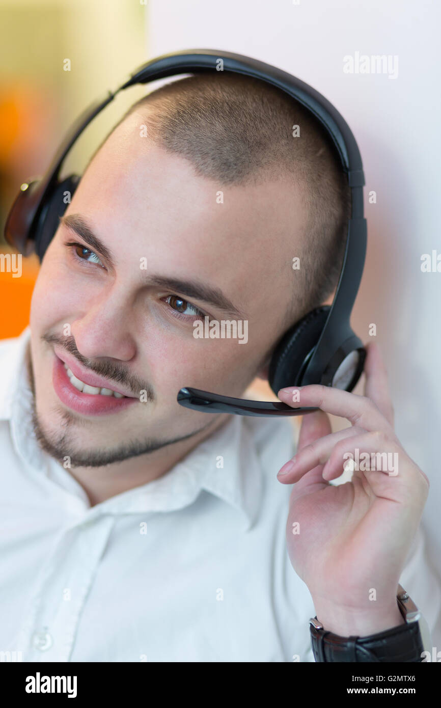 Young call center agent speaking with costumer Stock Photo - Alamy