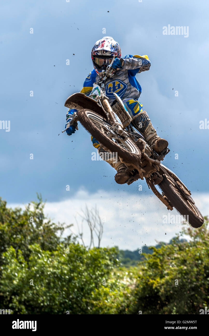 Biker on a motobike jumping at a motocross event, Epping, Essex, United ...