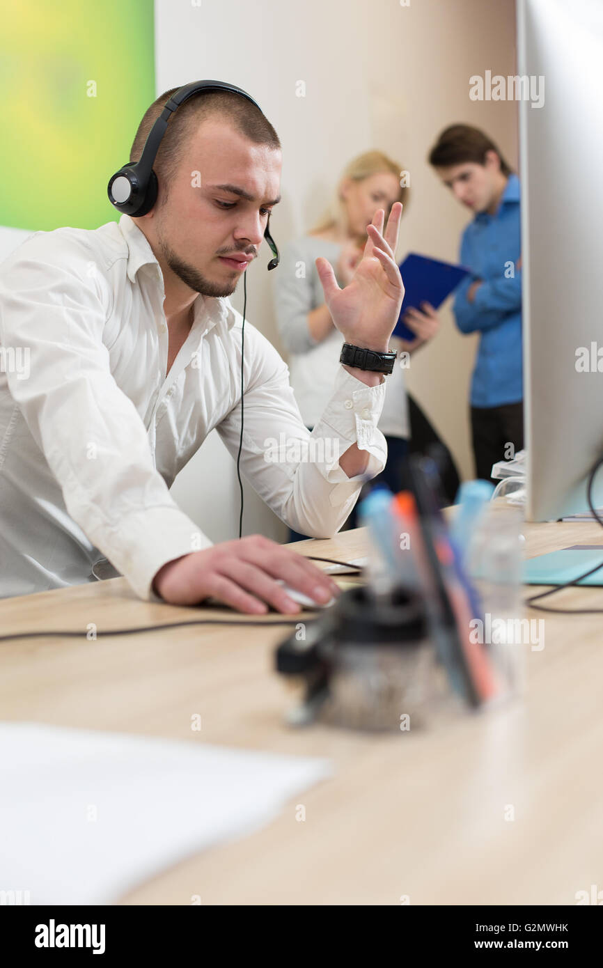 Stressed businessman unable to cope the telephone Stock Photo - Alamy