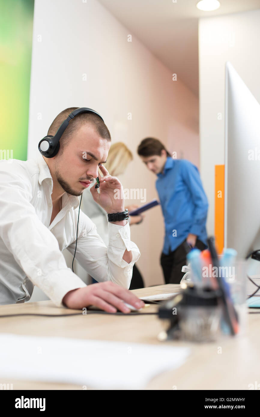 Stressed businessman unable to cope the telephone Stock Photo - Alamy