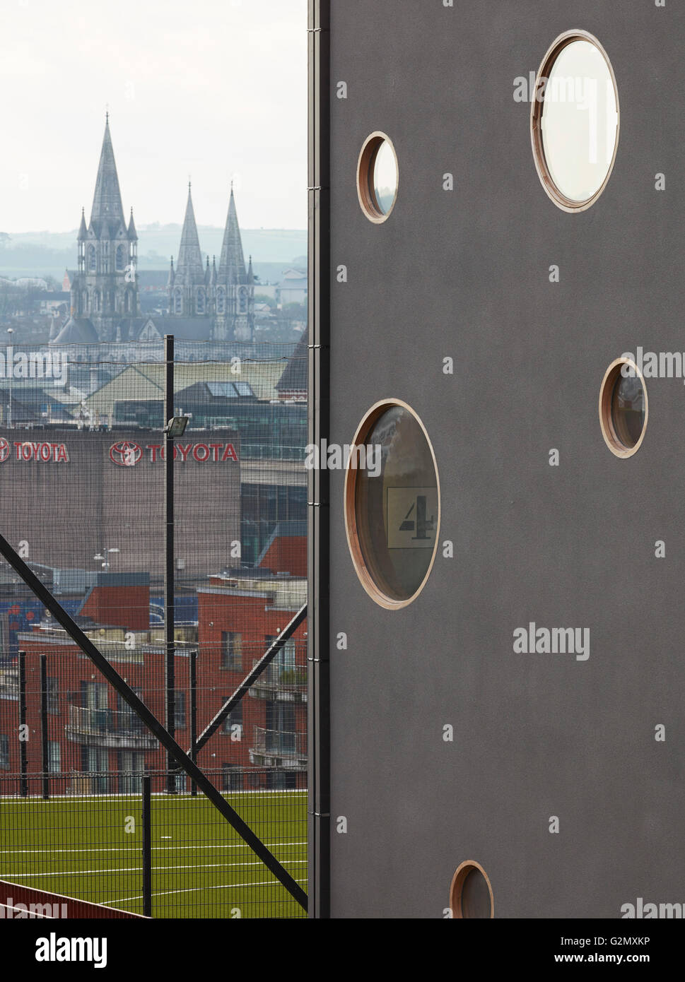 Exterior facade with circular windows and city. St Angela's College ...