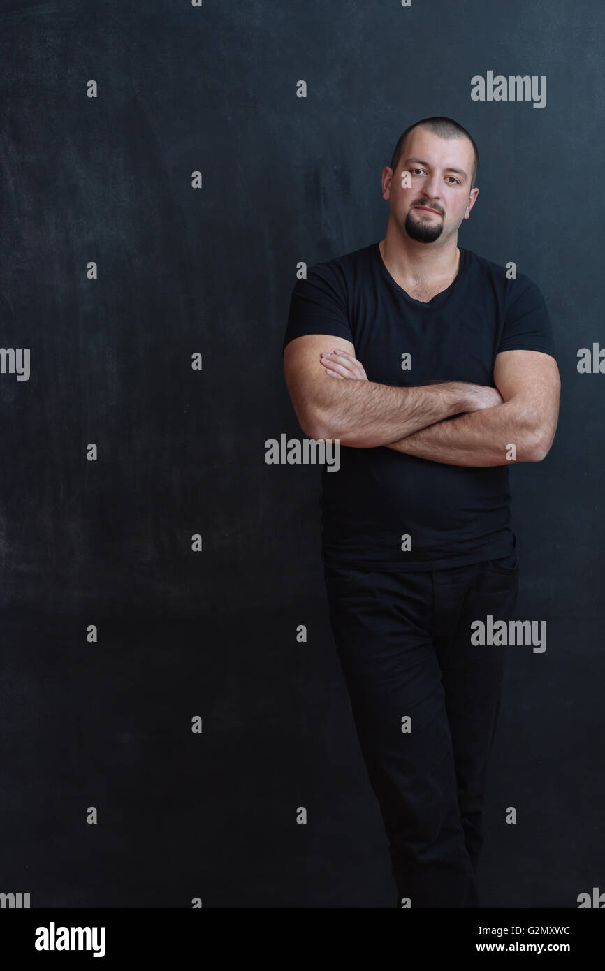 Handsome men doing different expressions on chalkboard Stock Photo - Alamy