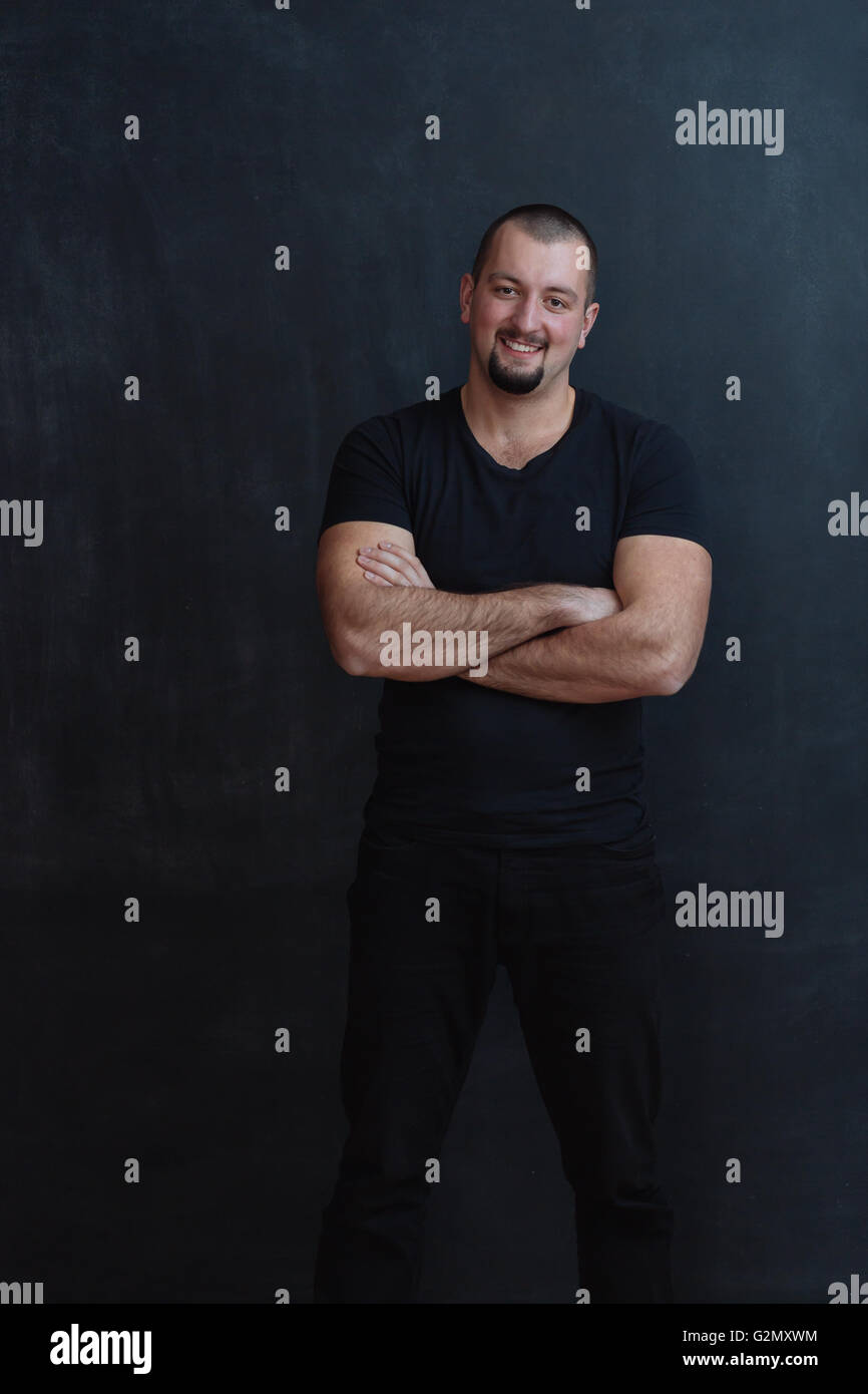 Handsome men doing different expressions on chalkboard Stock Photo - Alamy