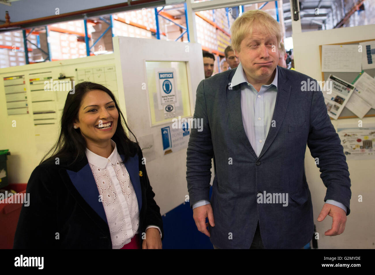 Boris Johnson and Priti Patel meet workers at clothing and uniform ...