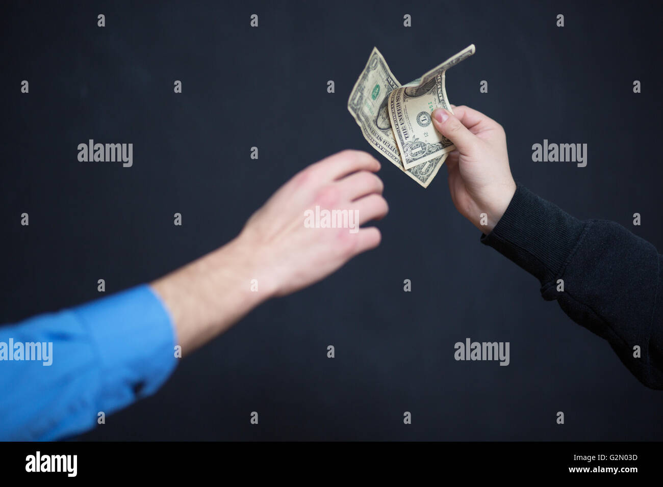 Concept - corruption. Giving a bribe. Money in hand Stock Photo - Alamy