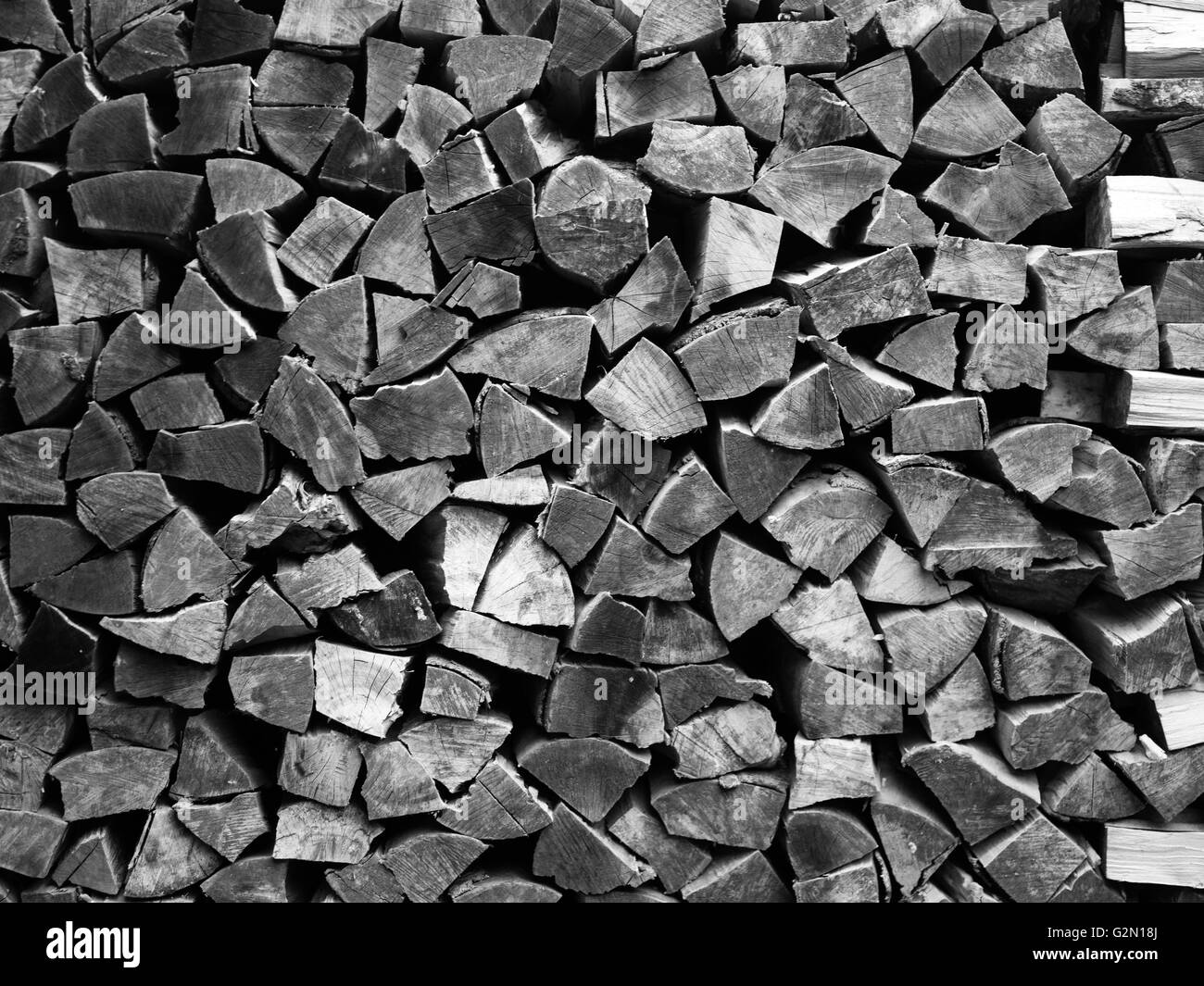 Pile of wood logs ready for winter - landscape exterior/ black and ...