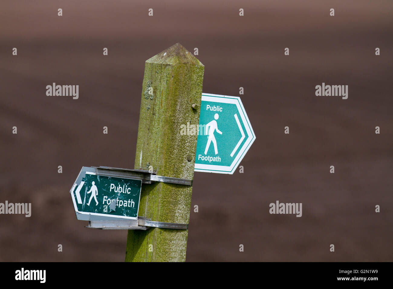 Two different waymarkers indicating Public footpath route signs across ...