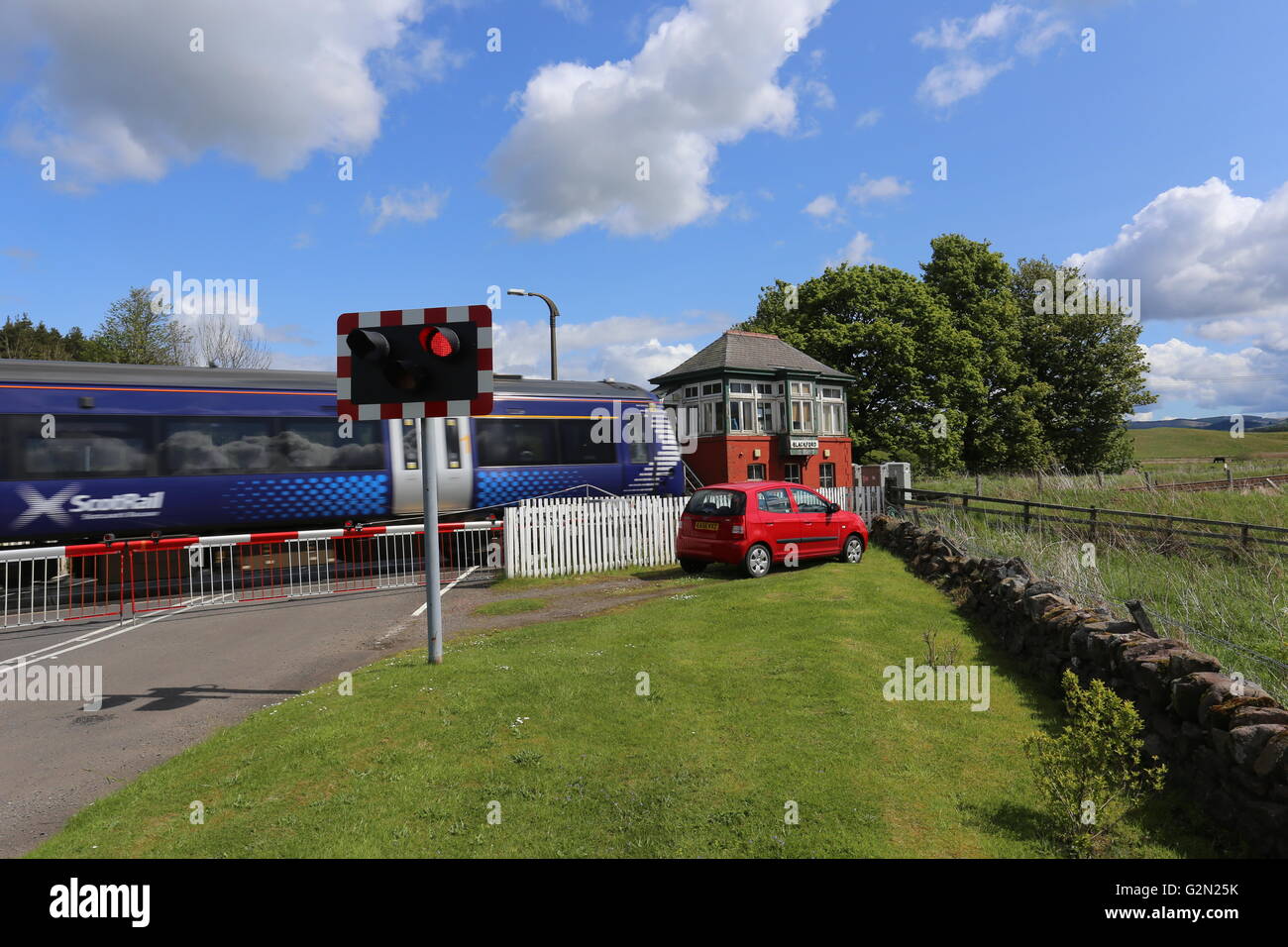 Scotrail train passing level crossing Blackford Scotland May 2016 Stock ...