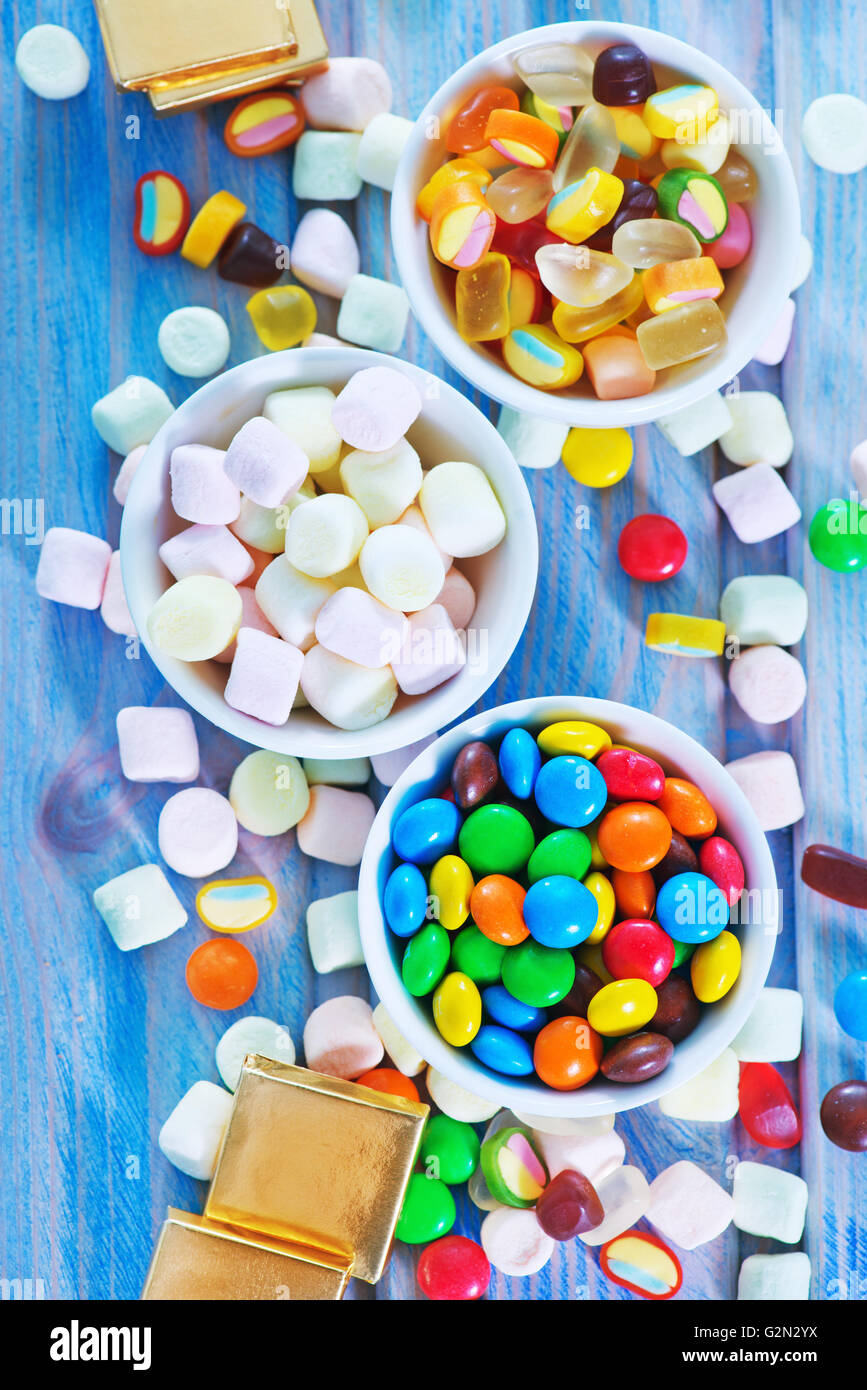 color candy in bowl and on a table Stock Photo - Alamy