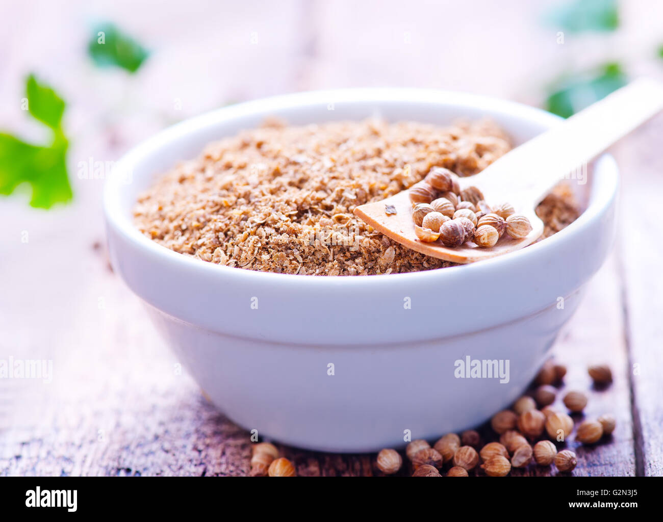 coriander in bowl and on a table Stock Photo - Alamy