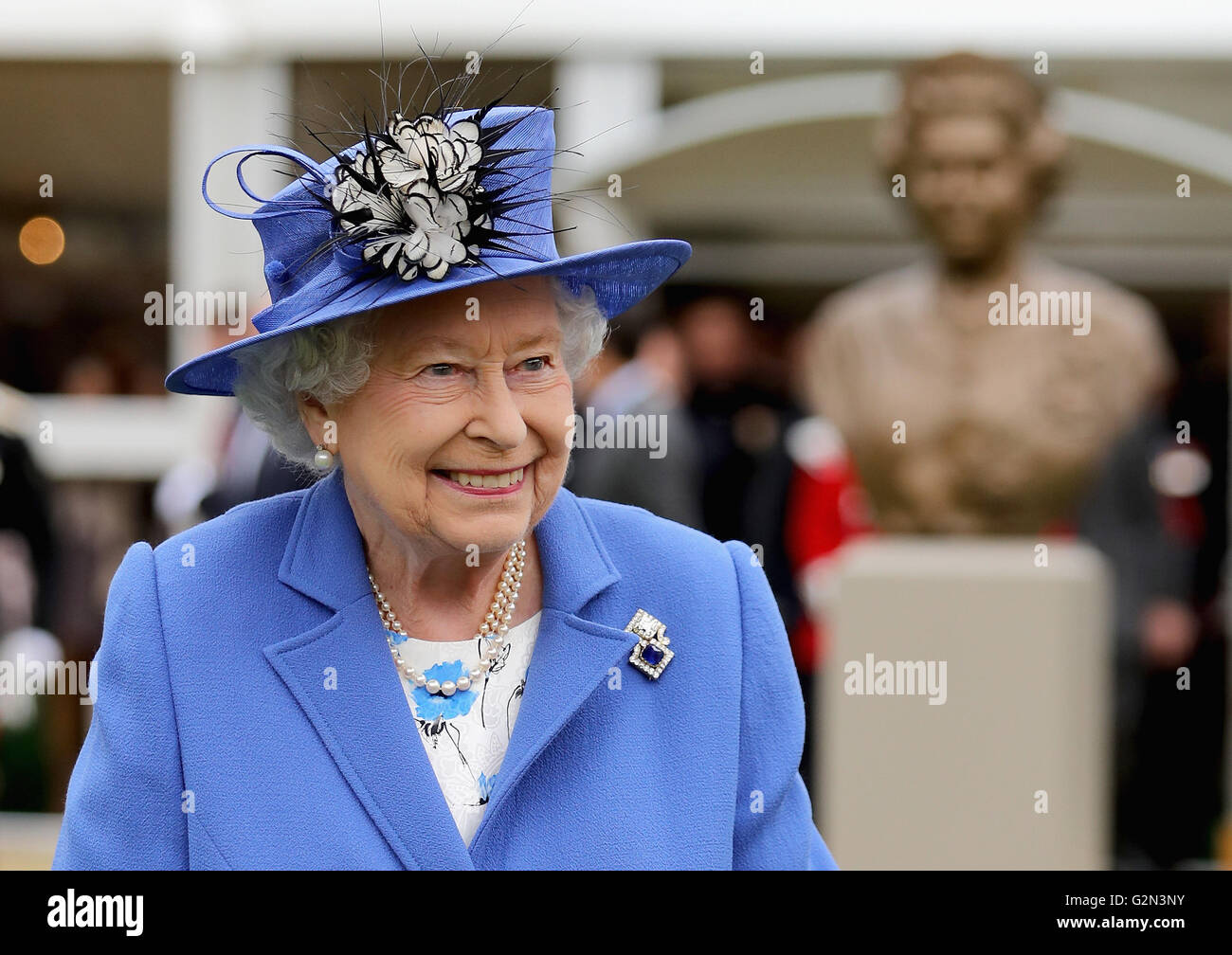 Queen Elizabeth II after the unveiling of a bronze bust of herself ...