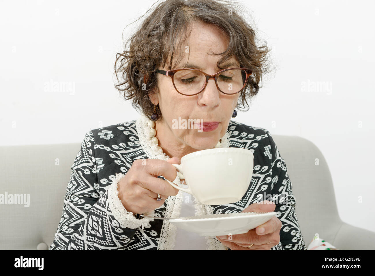 Mature lady drinking tea hi-res stock photography and images - Alamy