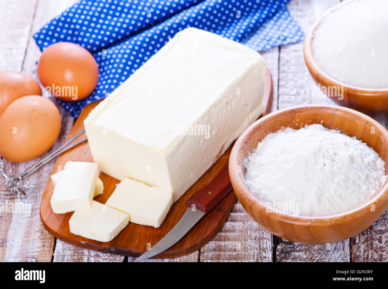 fresh butter on board and on a table Stock Photo - Alamy