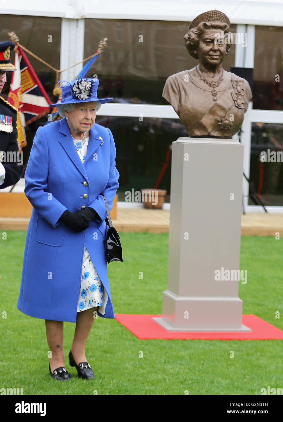 Queen Elizabeth II after the unveiling of a bronze bust of herself ...