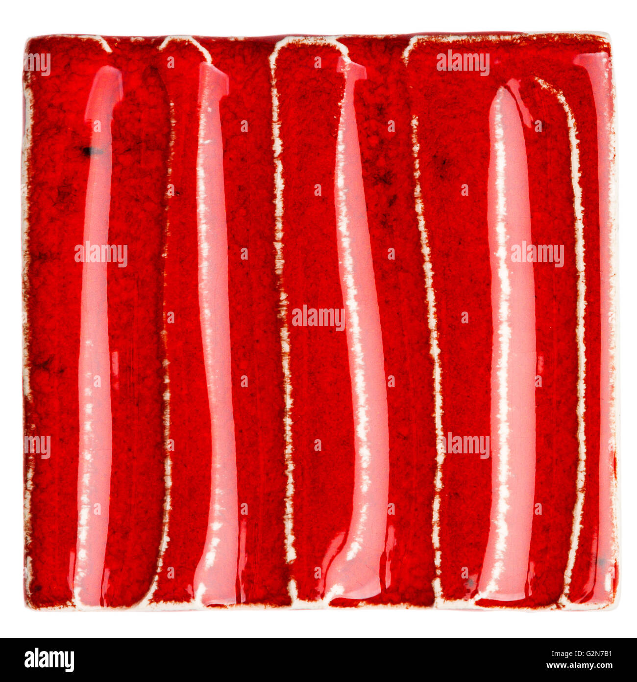 Red lined handmade glazed ceramic tile isolated on white background ...