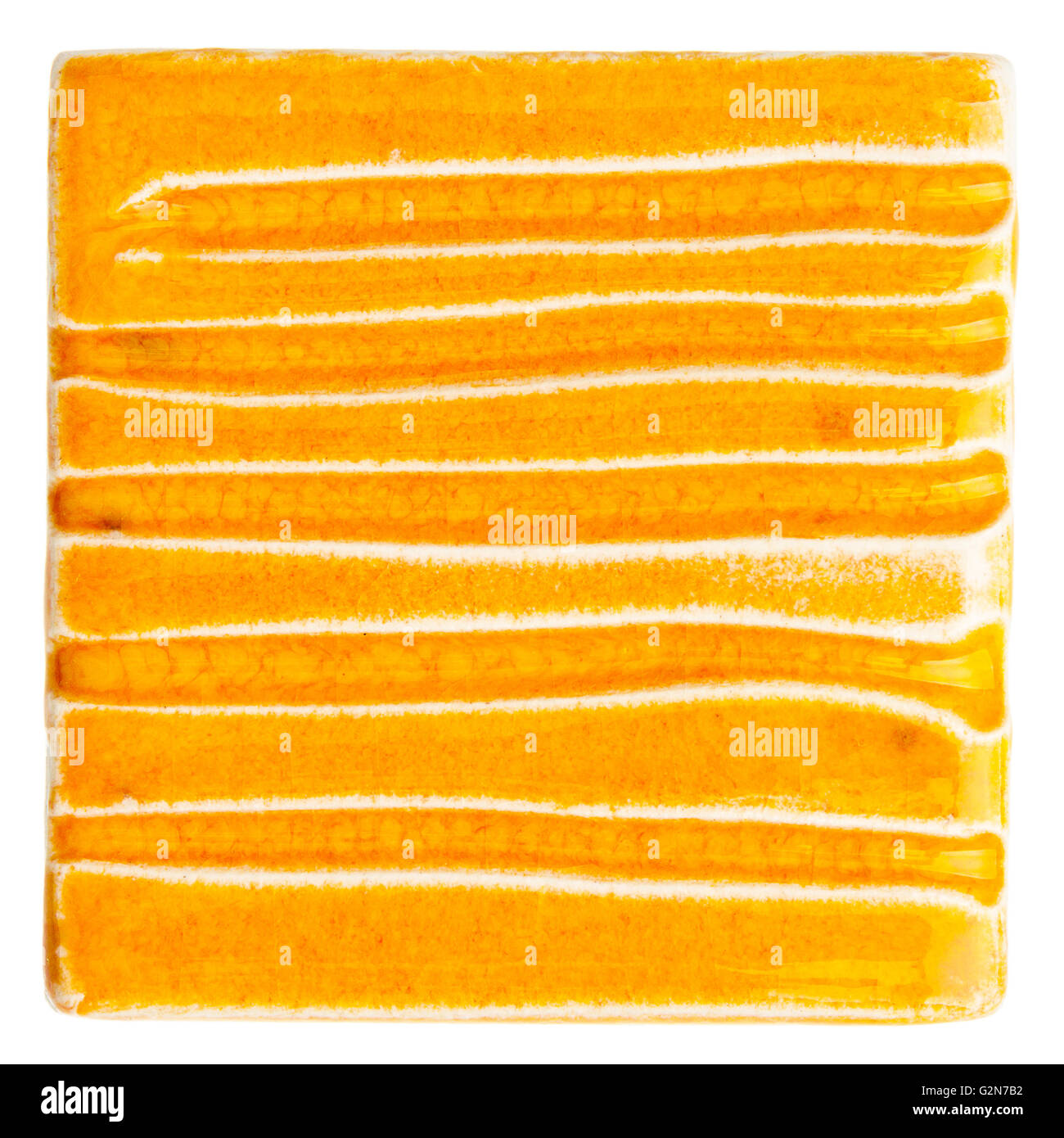 Orange lined handmade glazed ceramic tile isolated on white background ...