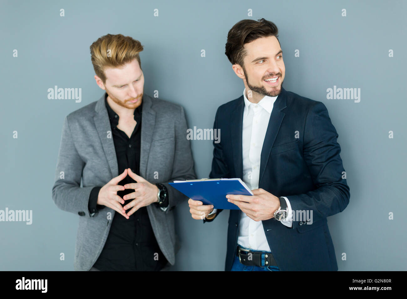Two businessmen working together in the office Stock Photo - Alamy