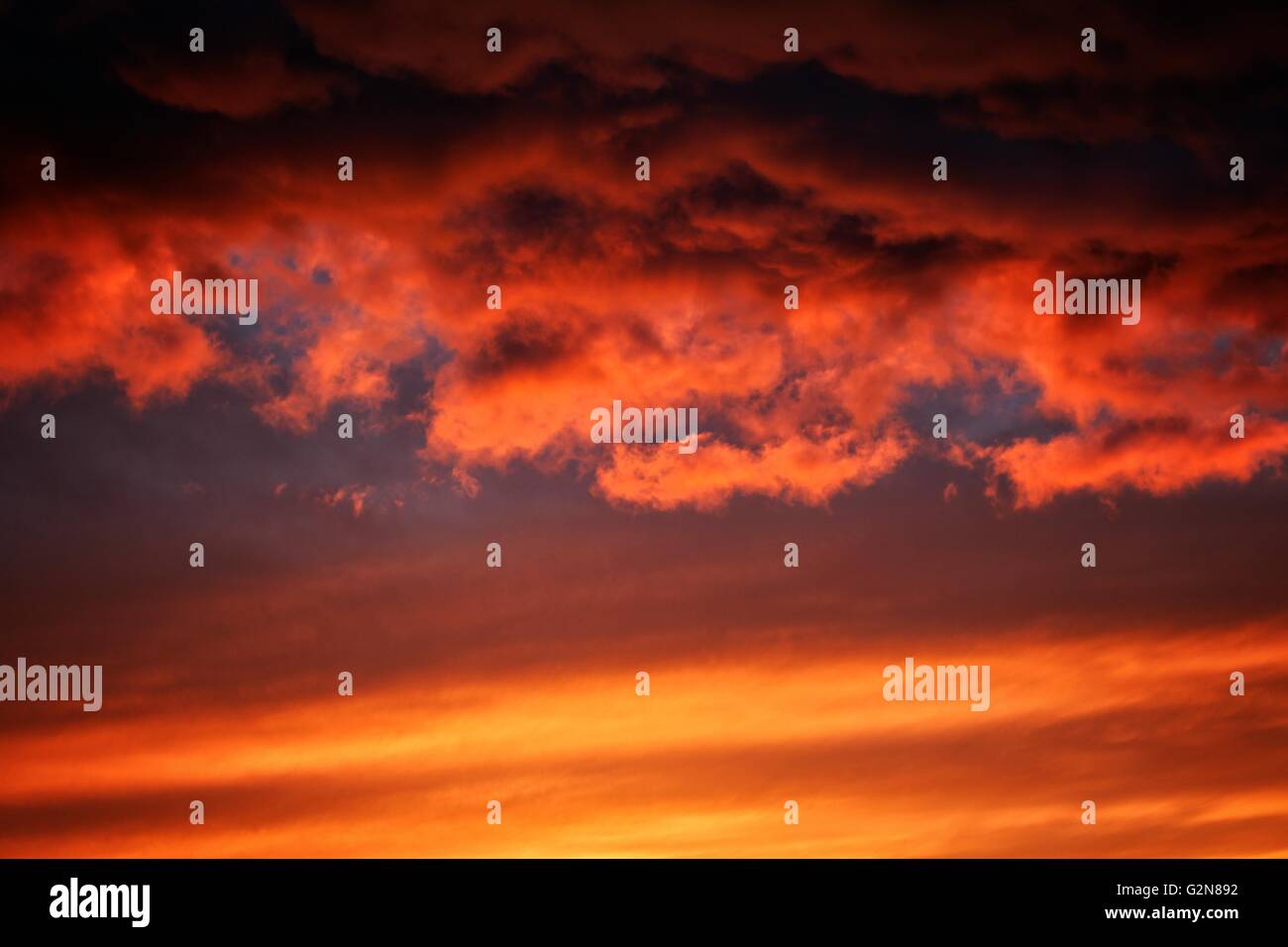 A sunset casting beautiful colours (colors) on the clouds Stock Photo ...