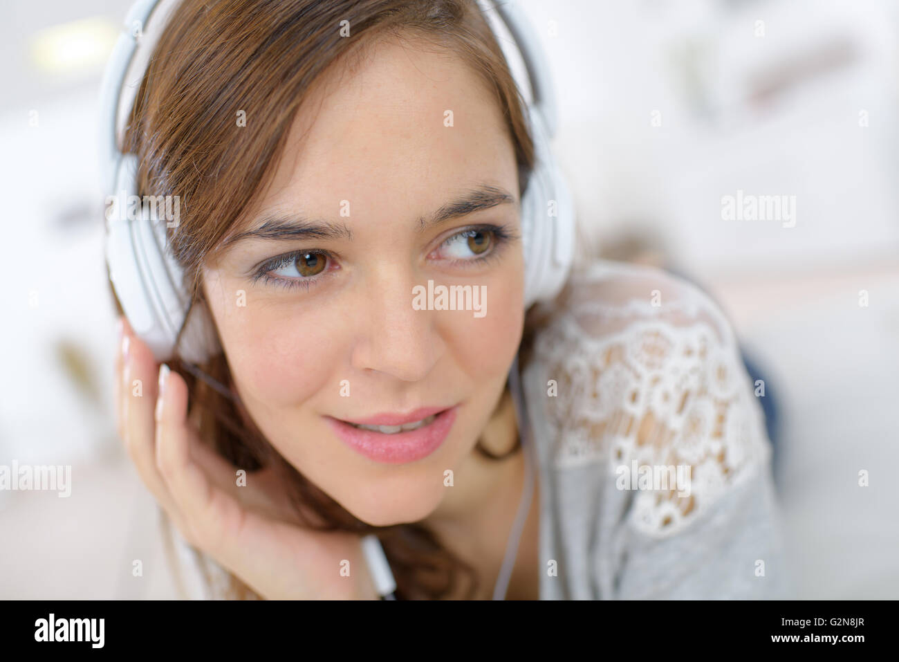 Woman relaxing to some music Stock Photo - Alamy