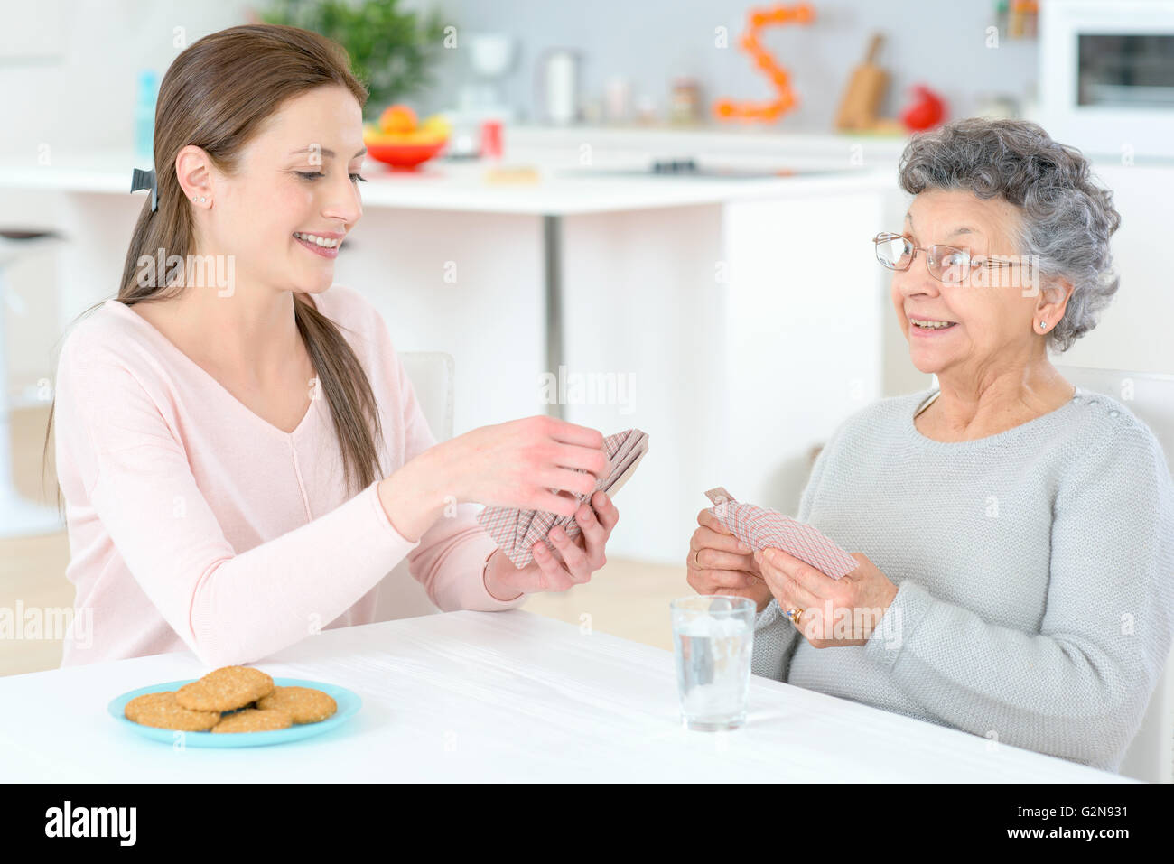 Playing cards with grandma Stock Photo - Alamy