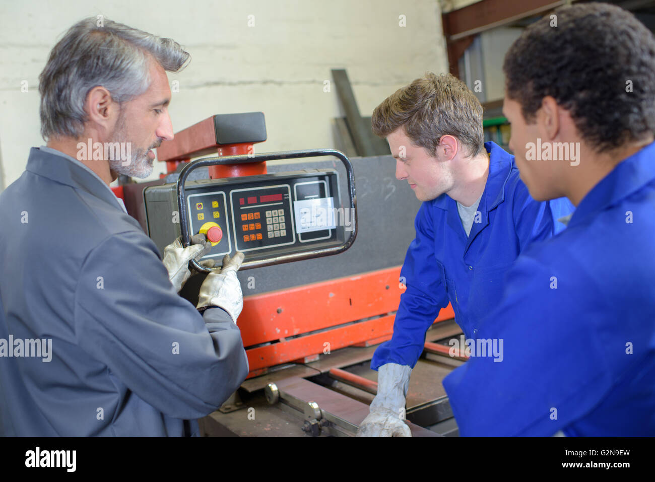 men with machine Stock Photo - Alamy