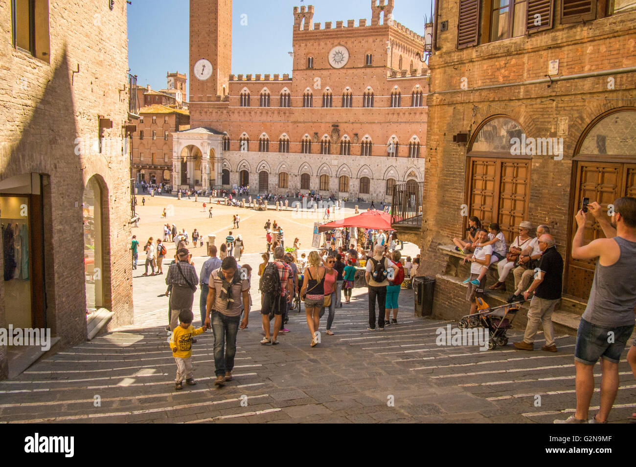 One of many entrances to "Il Campo", a medieval Piazza in Siena ...