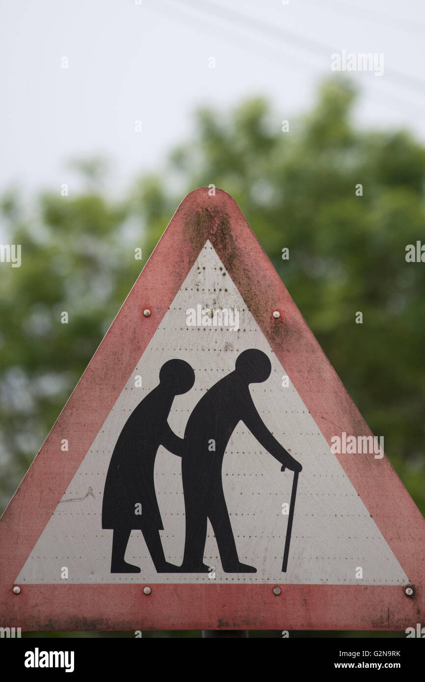 Road sign warning elderly people crossing hi-res stock photography and ...
