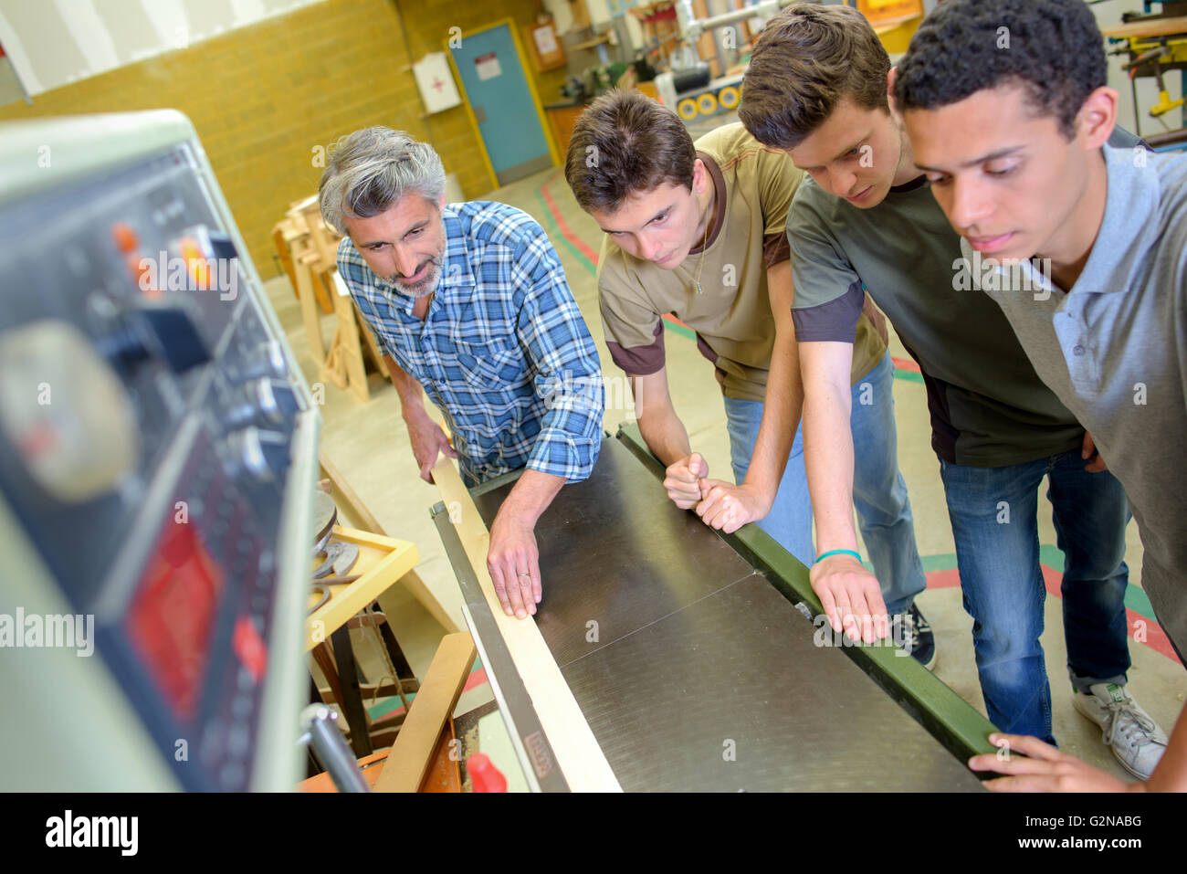 apprentice and teacher in the workshop Stock Photo - Alamy