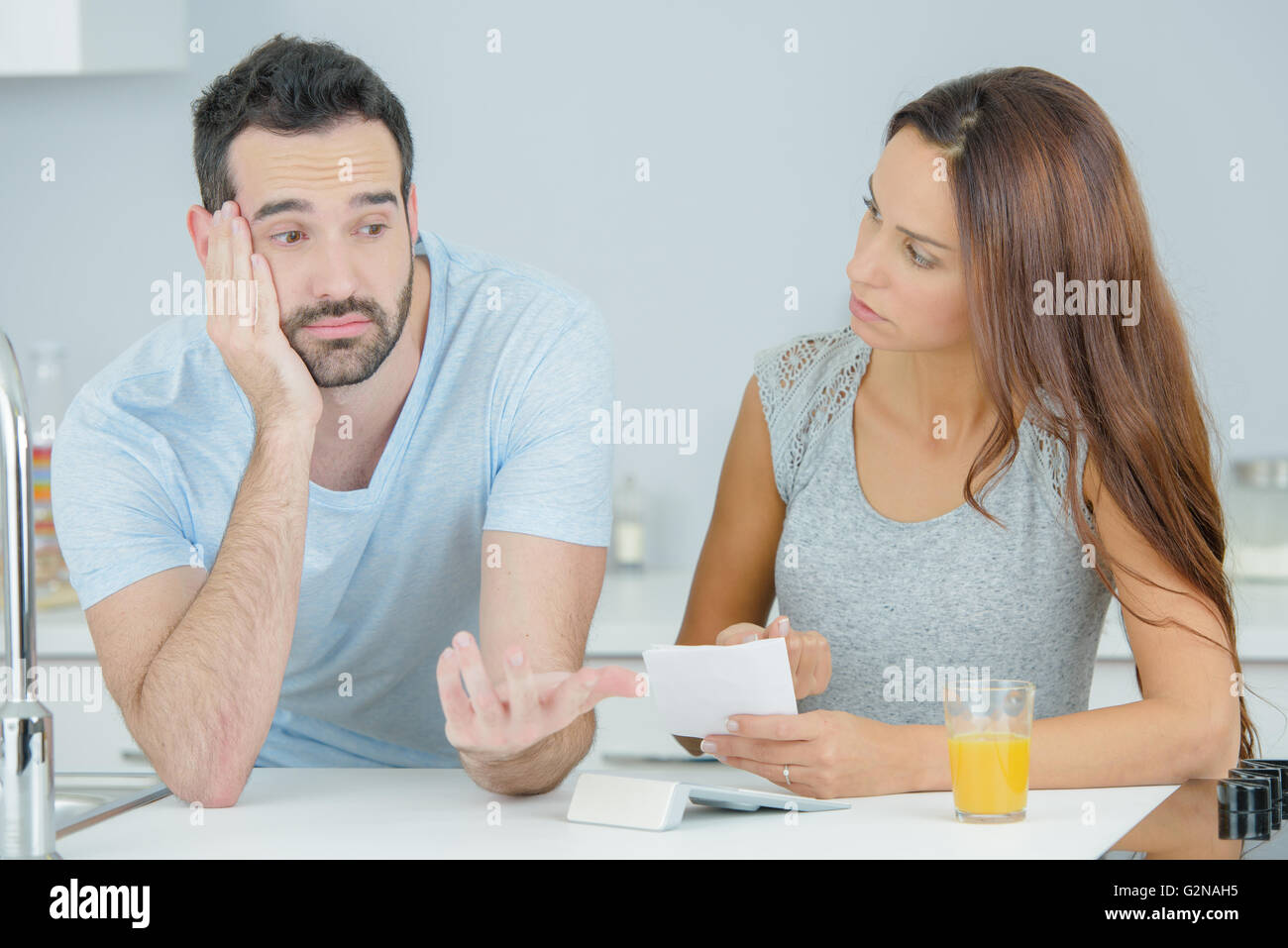 Couple arguing in the kitchen Stock Photo - Alamy