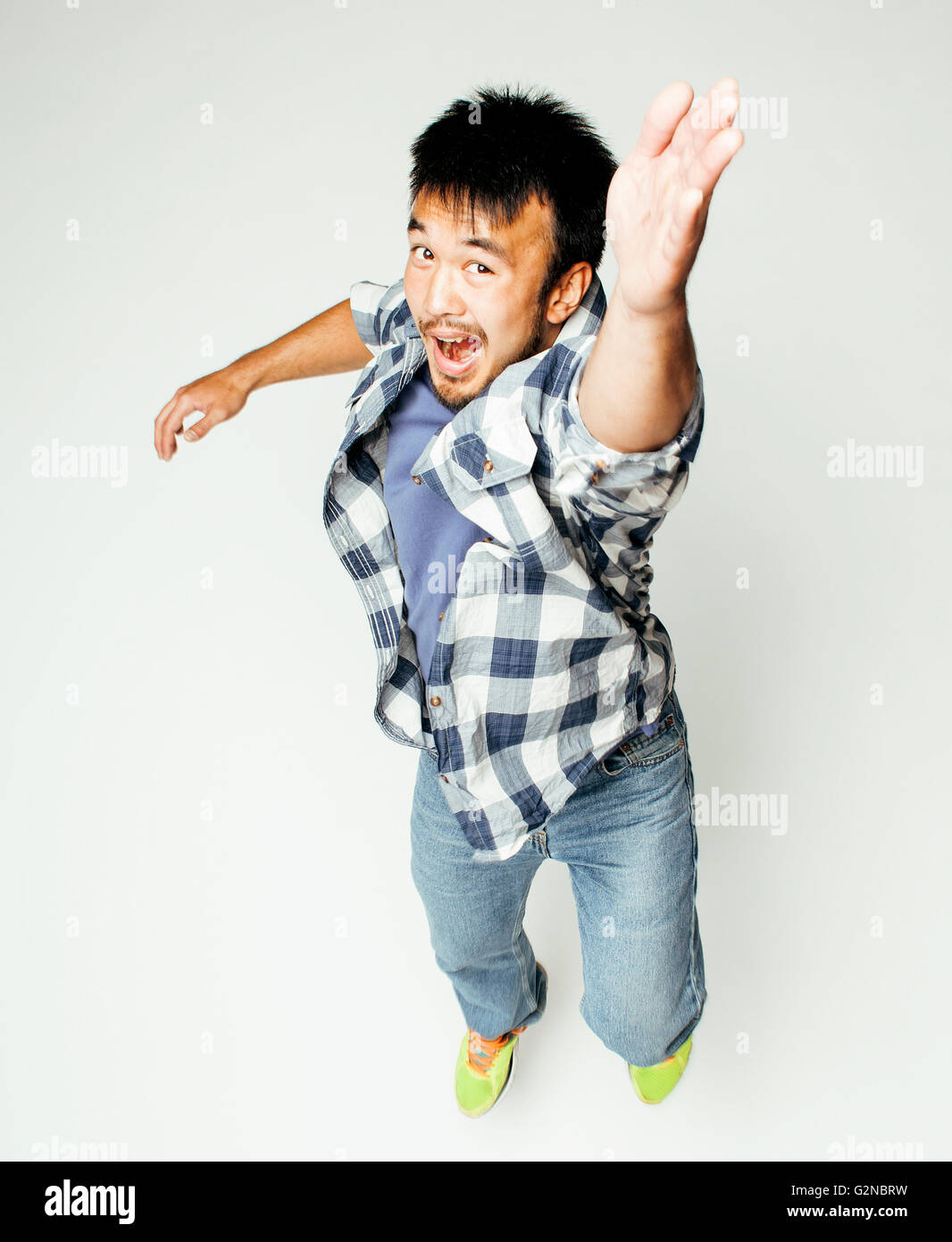 young pretty asian man jumping cheerful against white background ...