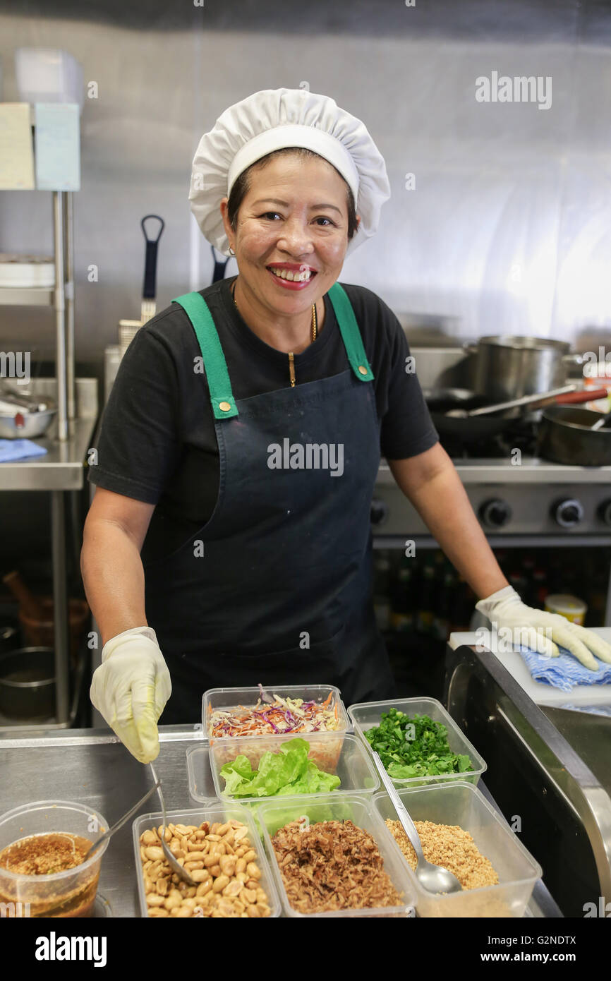 Woman asian smile kitchen hi-res stock photography and images - Alamy