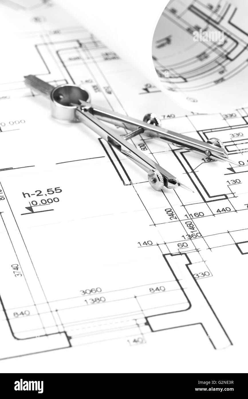 Architectural background with rolls of technical drawings and work ...