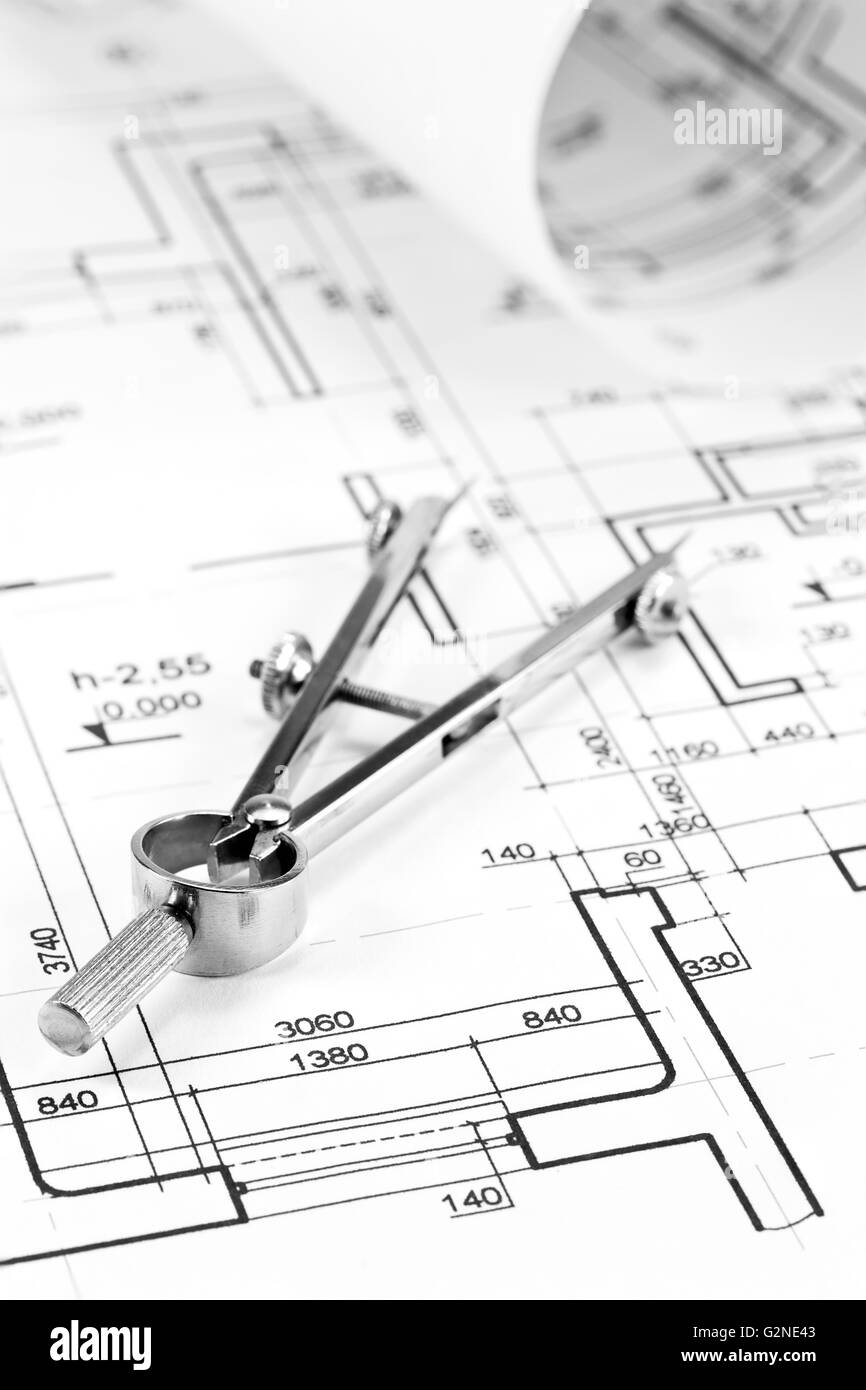 Architectural background with rolls of technical drawings and work ...