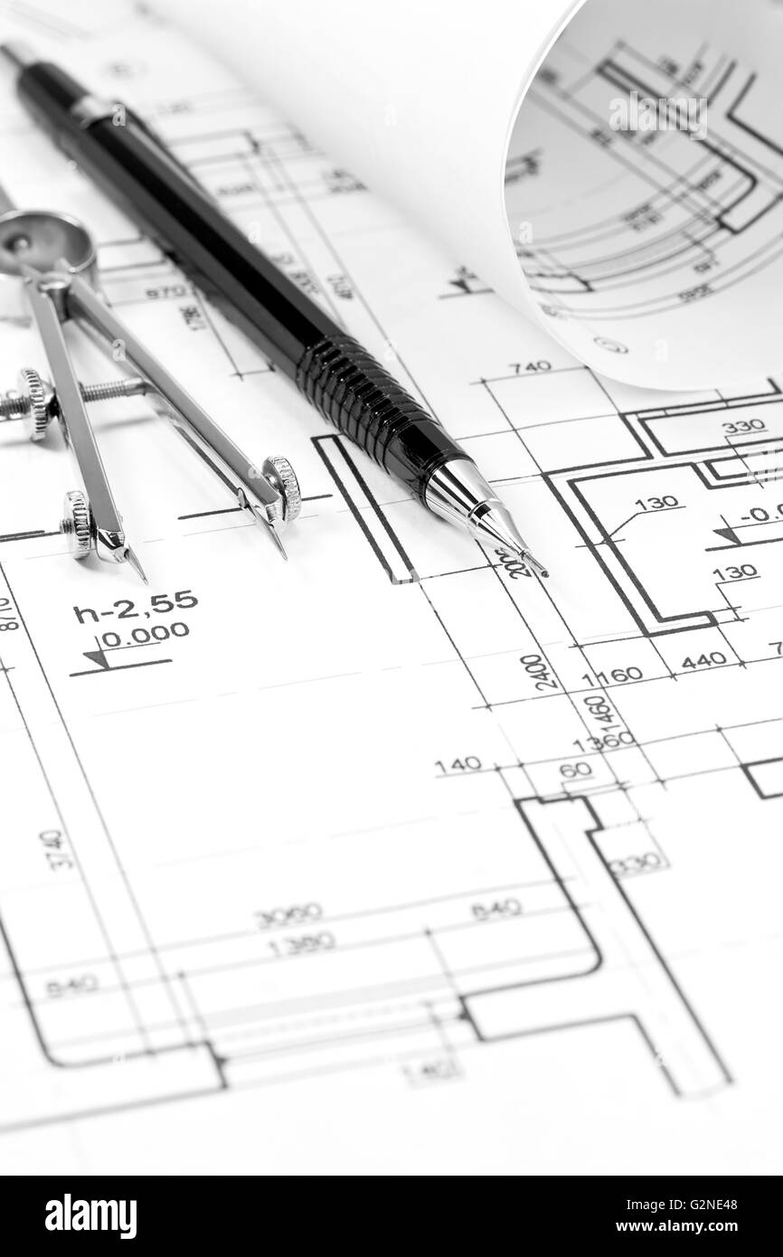 Architectural background with rolls of technical drawings and work ...