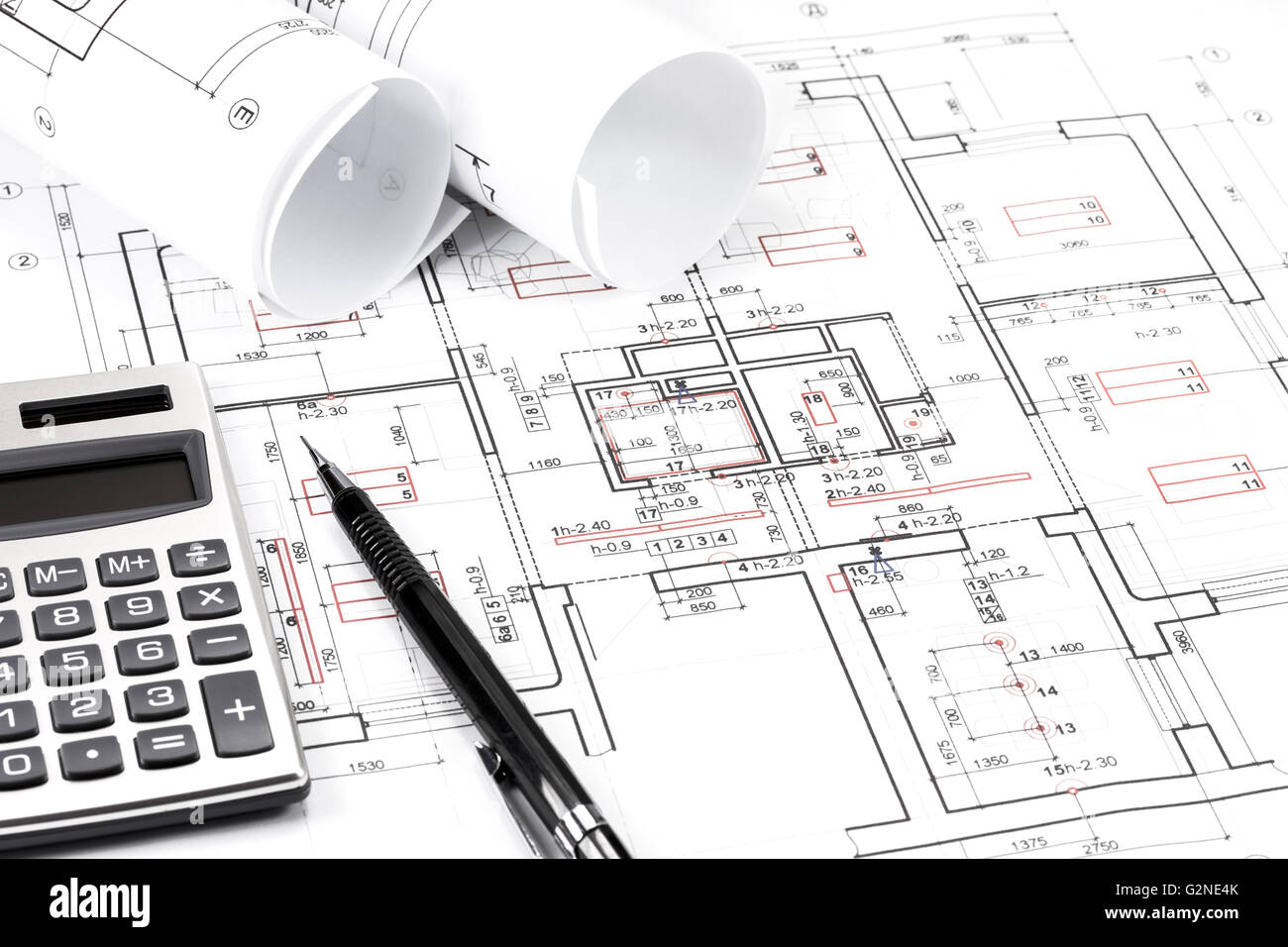 Architectural background with rolls of technical drawings and work ...