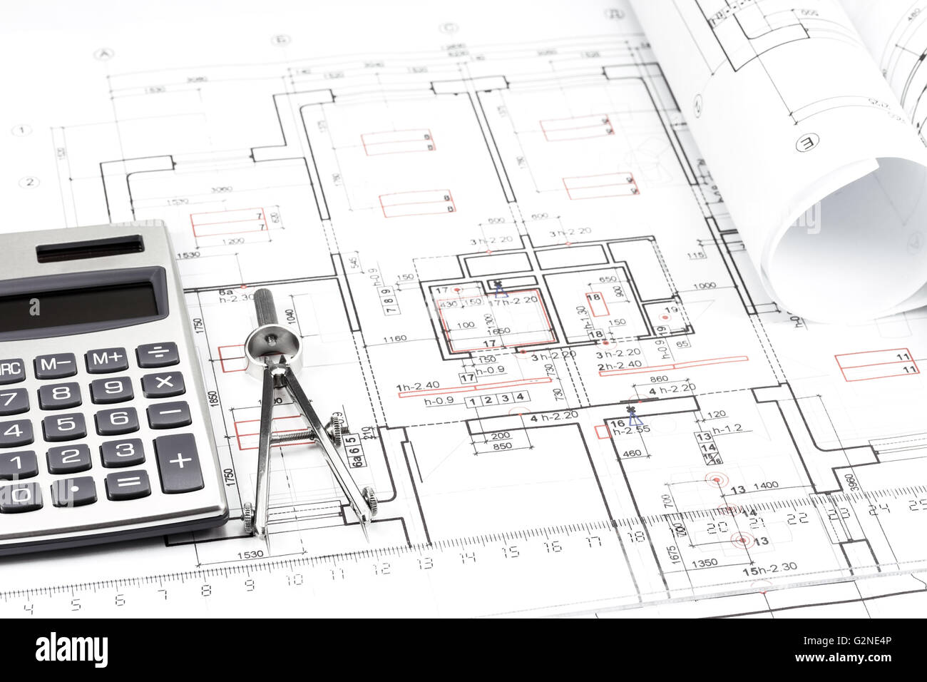 Architectural background with rolls of technical drawings and work ...
