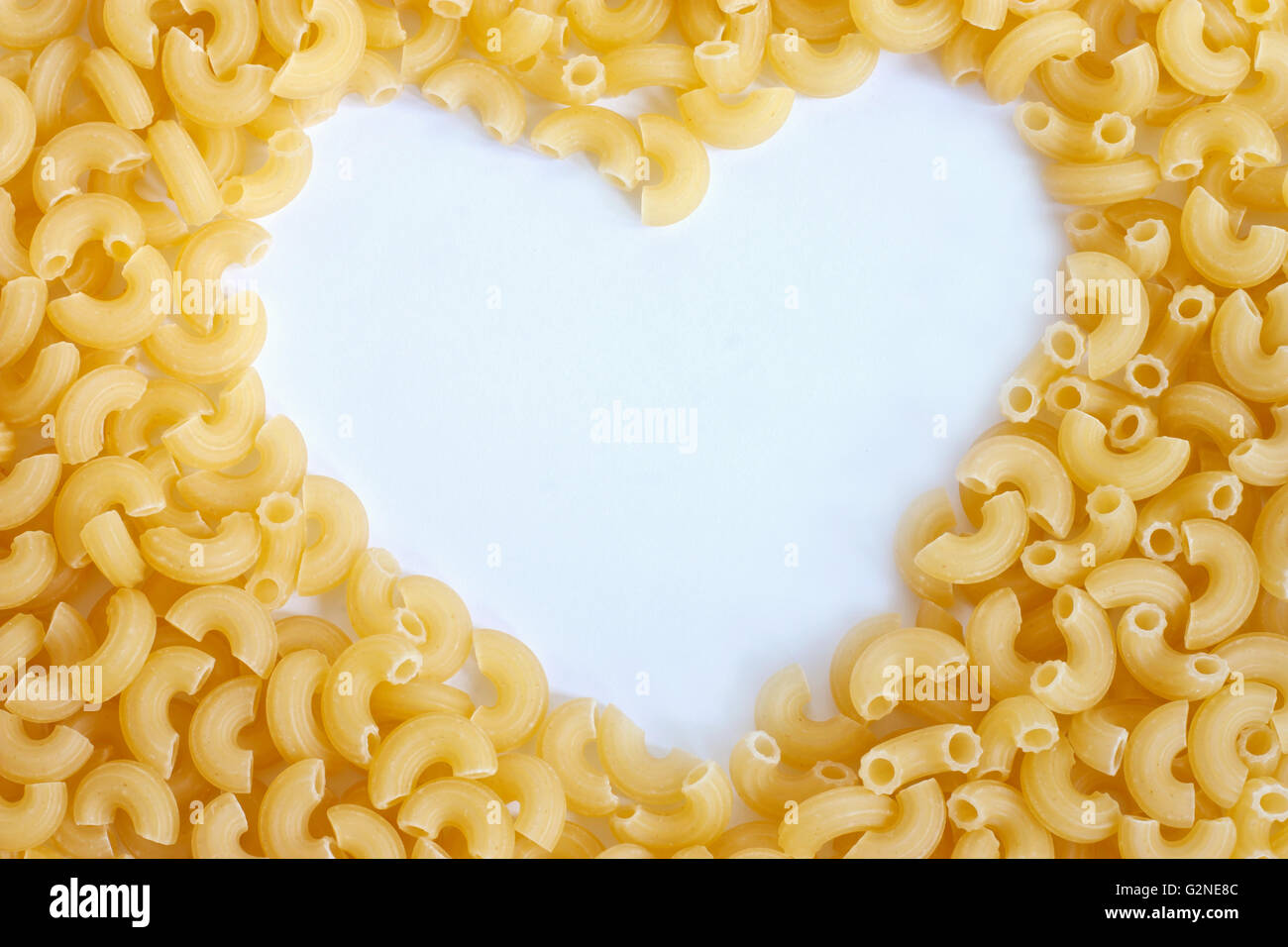 Macaroni pipe form with copy space in heart shape Stock Photo - Alamy