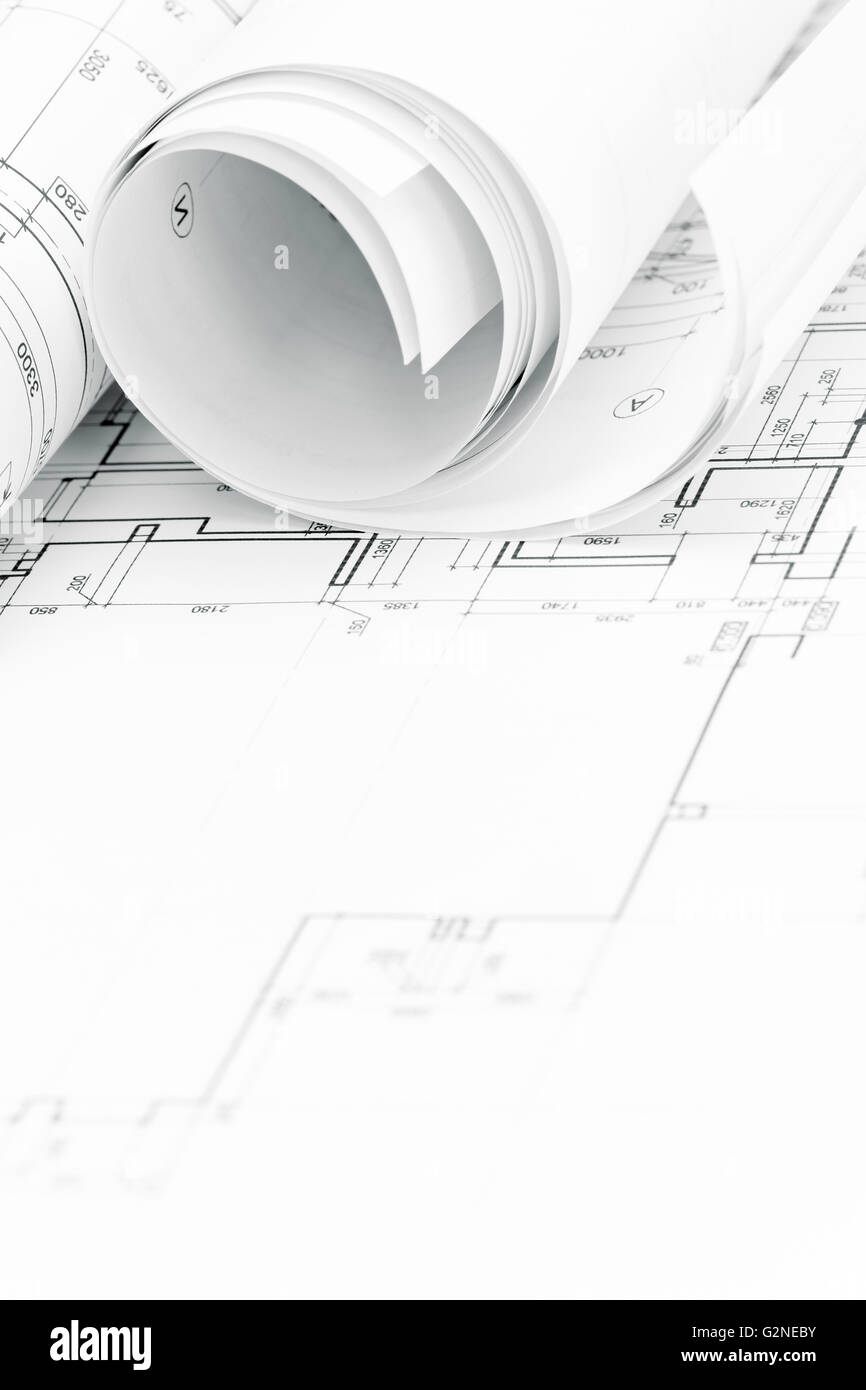 architectural background with floor plans and rolls of technical ...