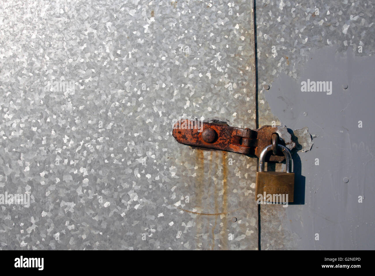 Steel doors securely locked with a rusty padlock Stock Photo - Alamy Steel doors securely locked with a rusty padlock Stock Photo - Alamy