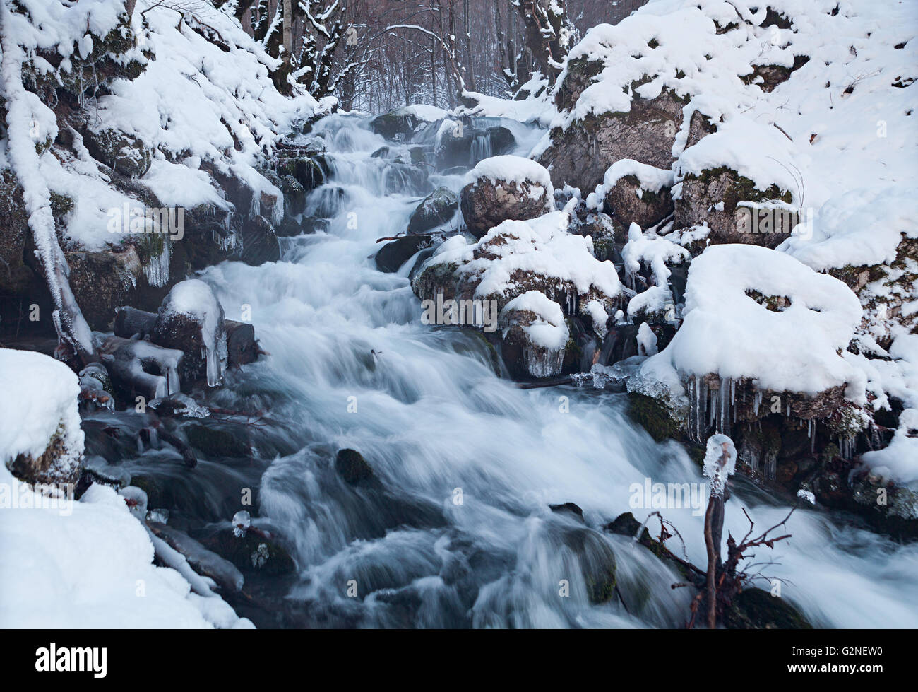 Water in frozen stream Stock Photo - Alamy