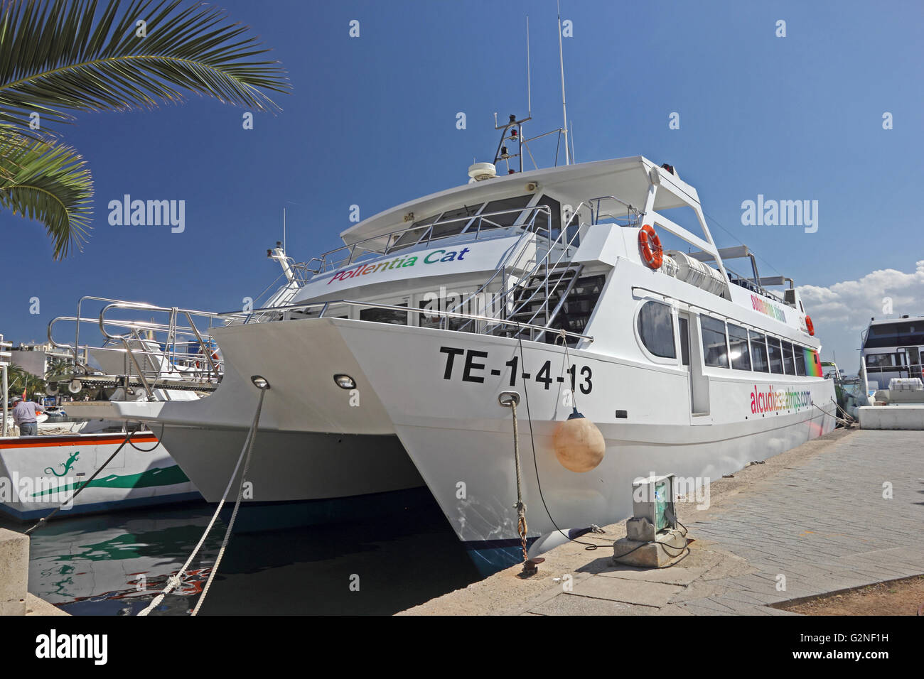 Pollentia Cat catamaran moored at dock in Port d'Alcudia, Mallorca ...