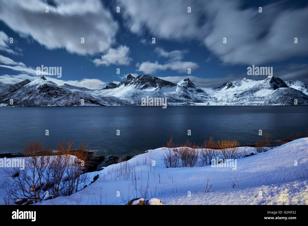 winter landscape in fjord of Husøy i Senja,night shot with moon light ...