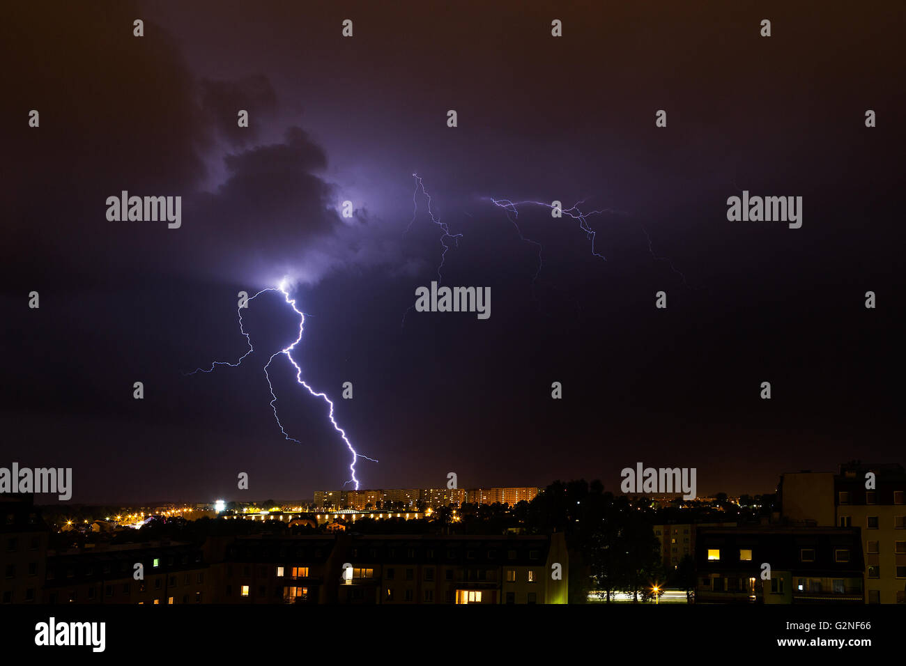 Clouds and thunder lightnings and storm over city Stock Photo - Alamy