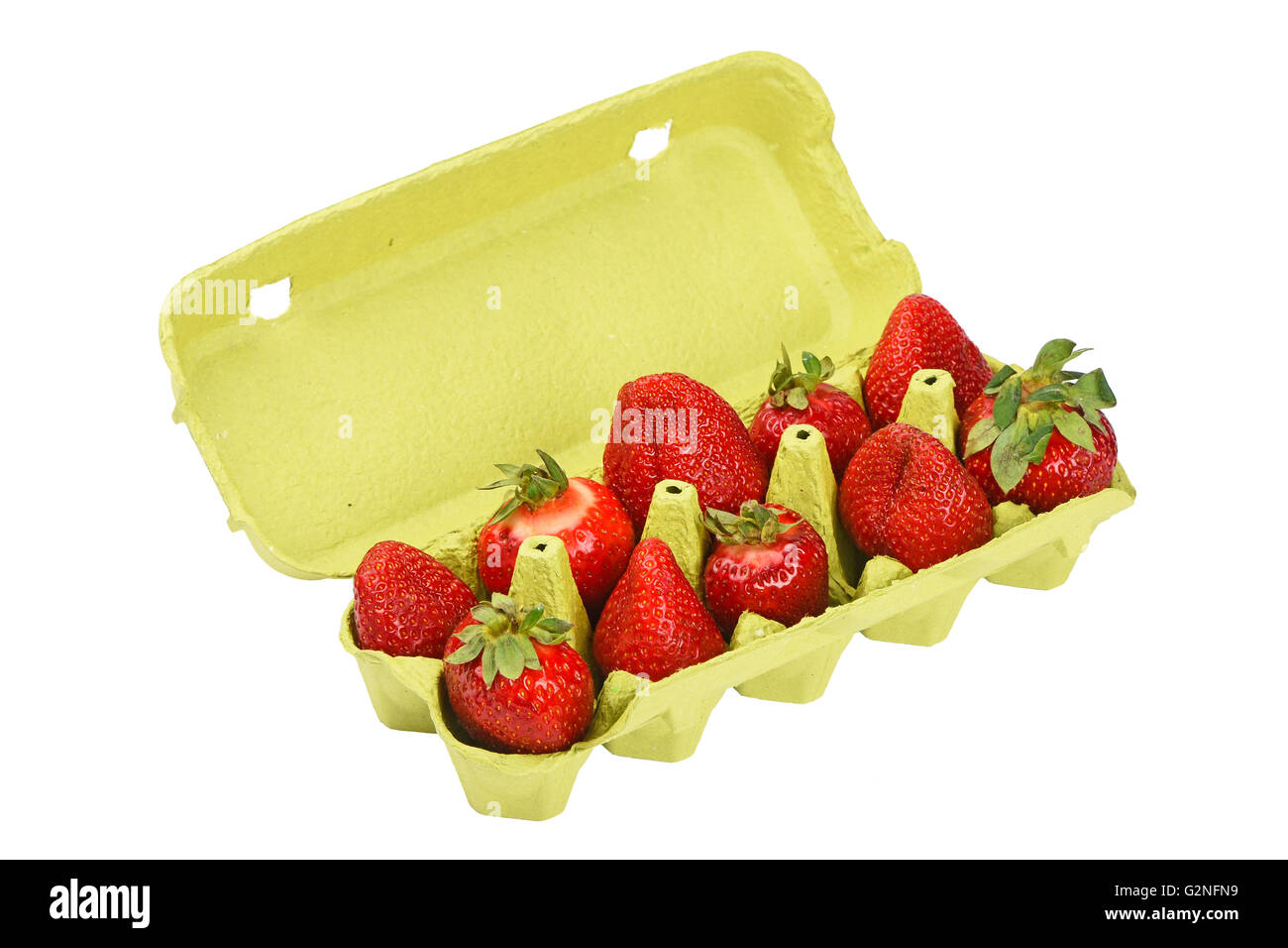 Red mellow strawberry in open green carton egg carrier container tray ...