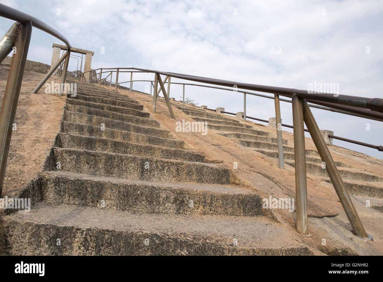 Gateway and rock cut steps leading to the Gomateshwara temple ...