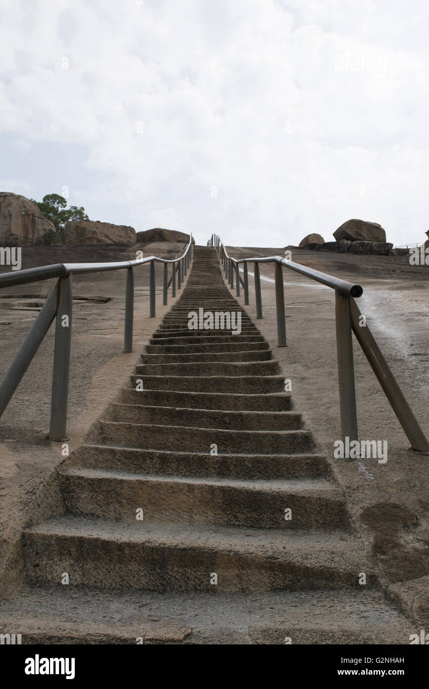 Gateway and rock cut steps leading to the Jain temple complex ...