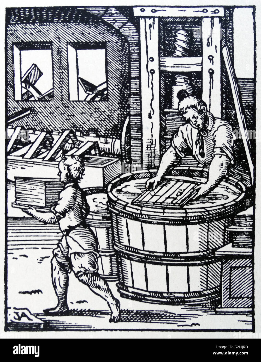 Woodcut depicts the early process of paper making. The raw materials ...