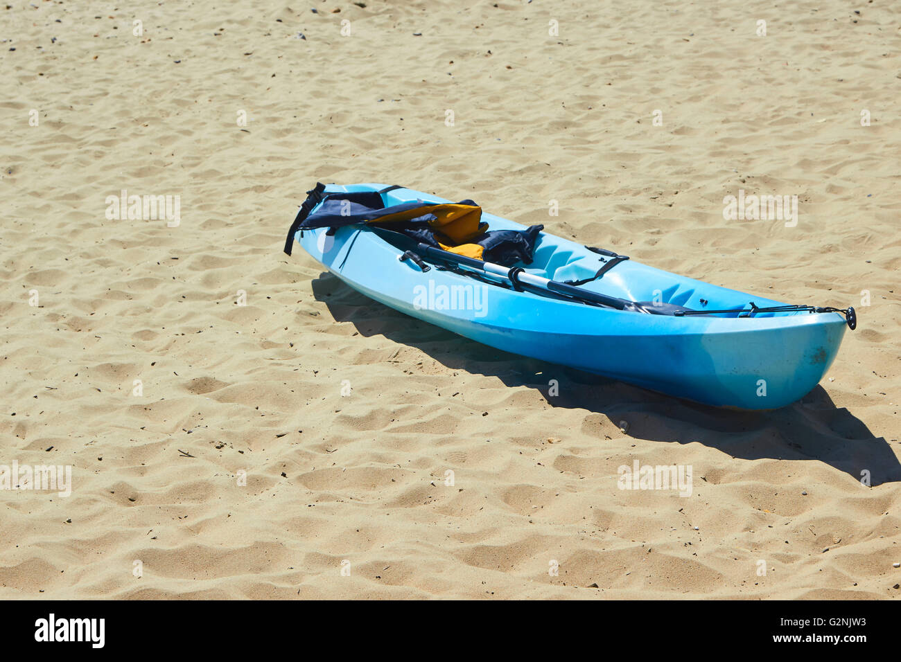 Kayaks on the beach in different colors, sunny day at the sea Stock ...