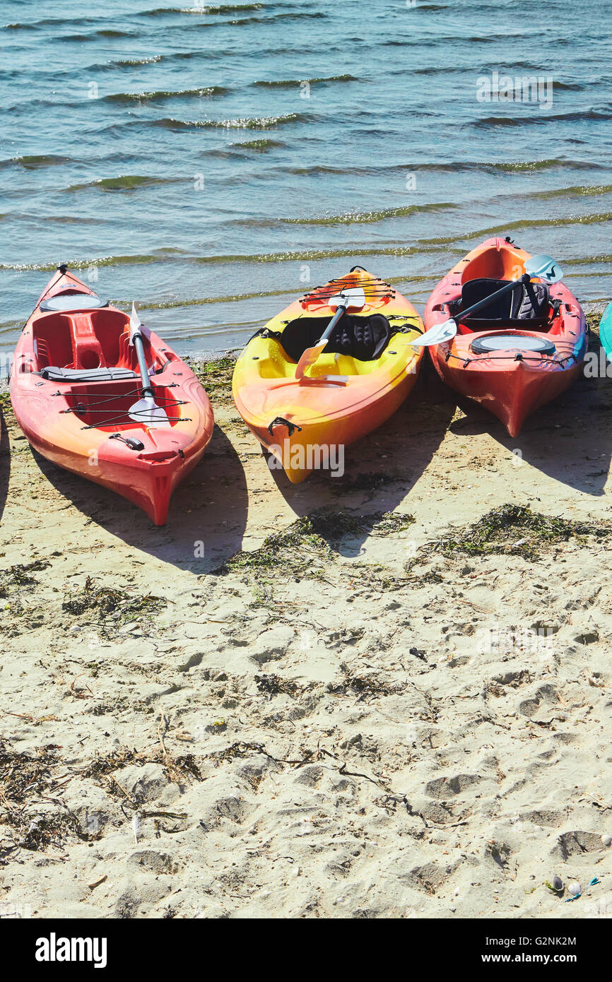 Kayaks on the beach in different colors, sunny day at the sea Stock ...