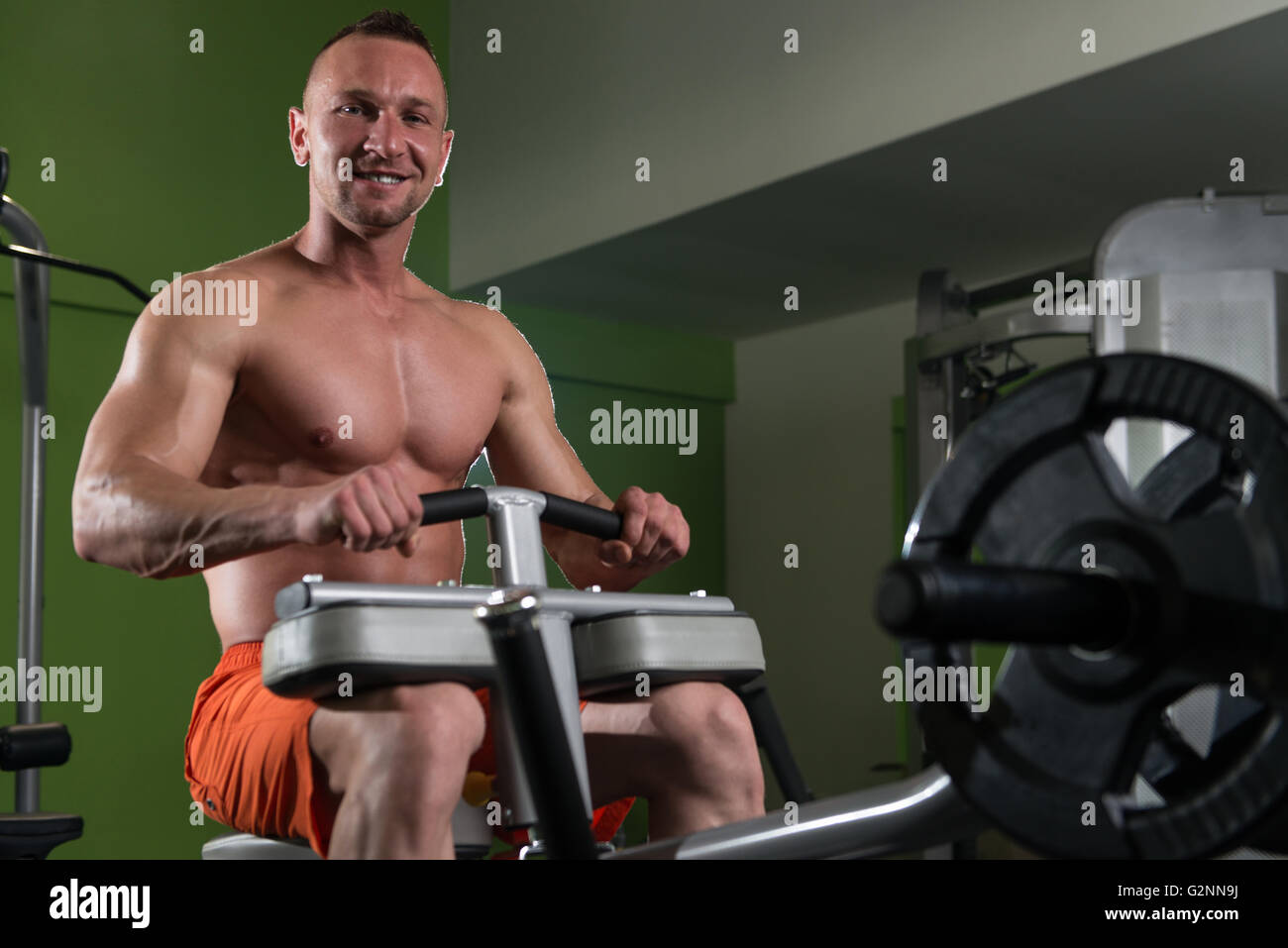 Bodybuilder Doing Heavy Weight Exercise For Legs Calves Stock Photo - Alamy